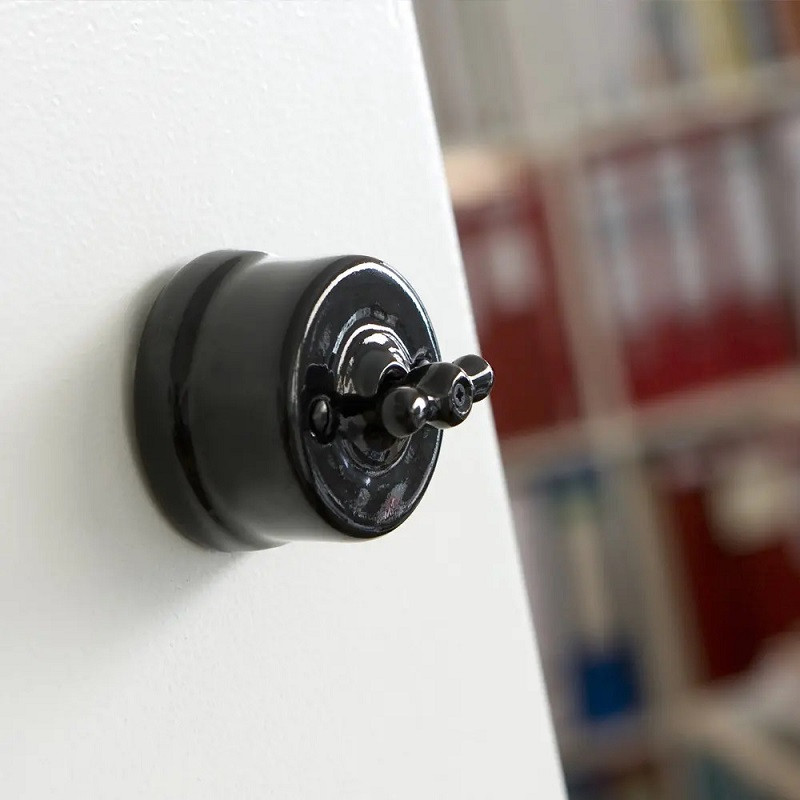 Porcelain surface-mounted toggle switch