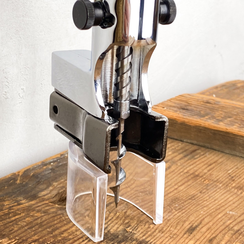 Chrome wall-mounted corkscrew