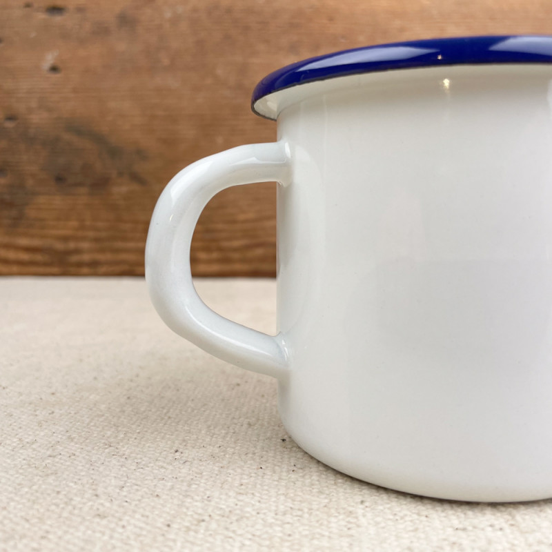 White enamel mug with blue border